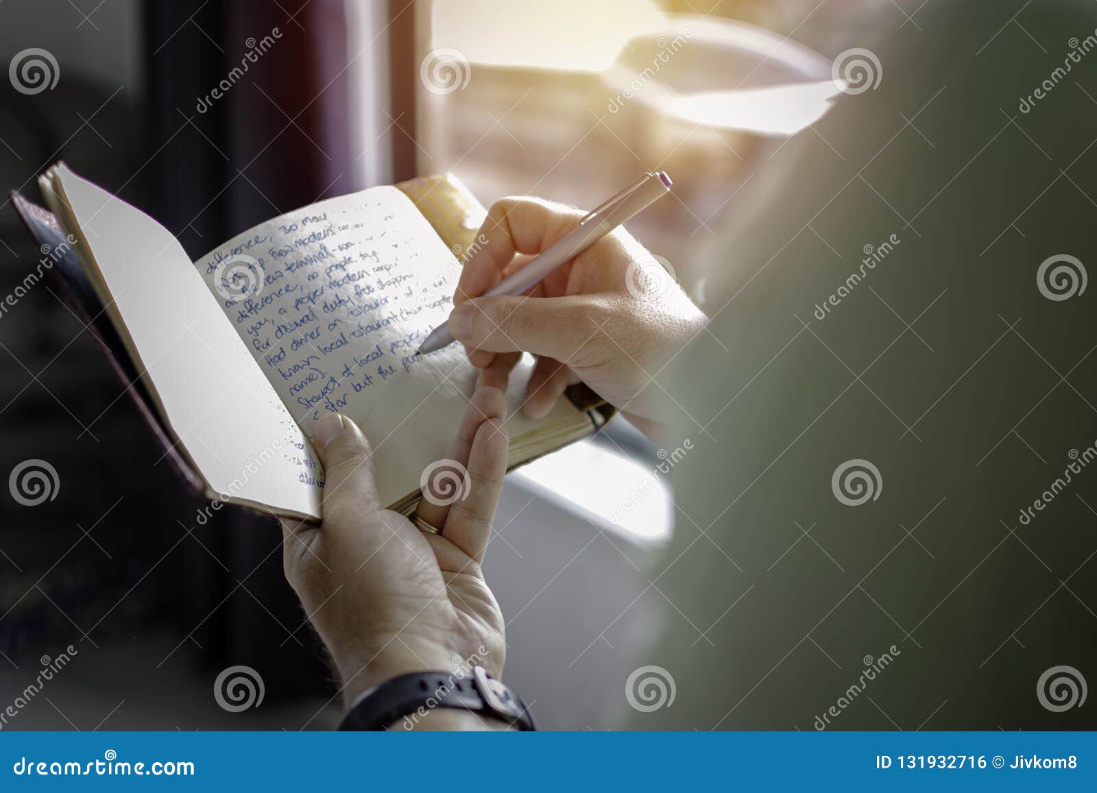 A Young Successful Person Taking Notes in a Personal Journal Stock ...