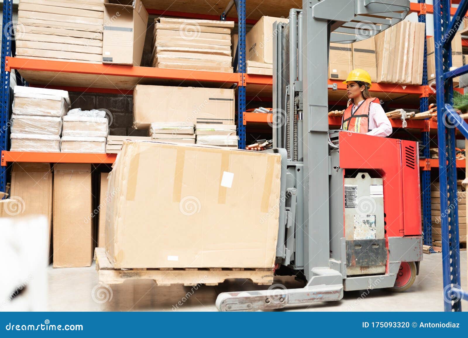 Young Supervisor Using Machinery at Warehouse Stock Photo - Image of ...