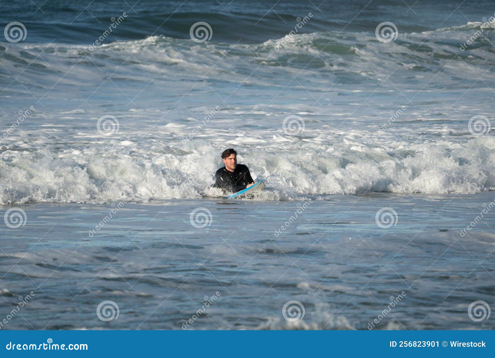 Young Surfer Catching Waves before Work on an Early Friday Morning at ...