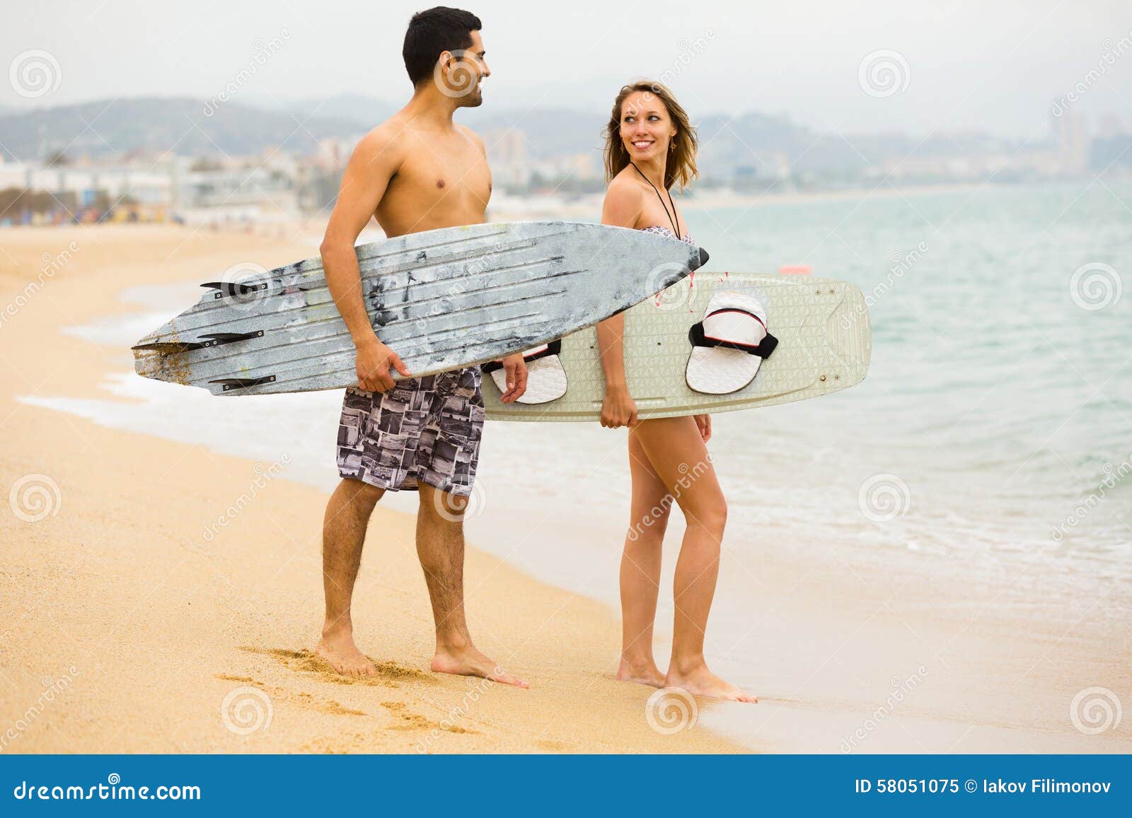 Young Surfers Couple On The Beach Stock Image Image Of Beach Board