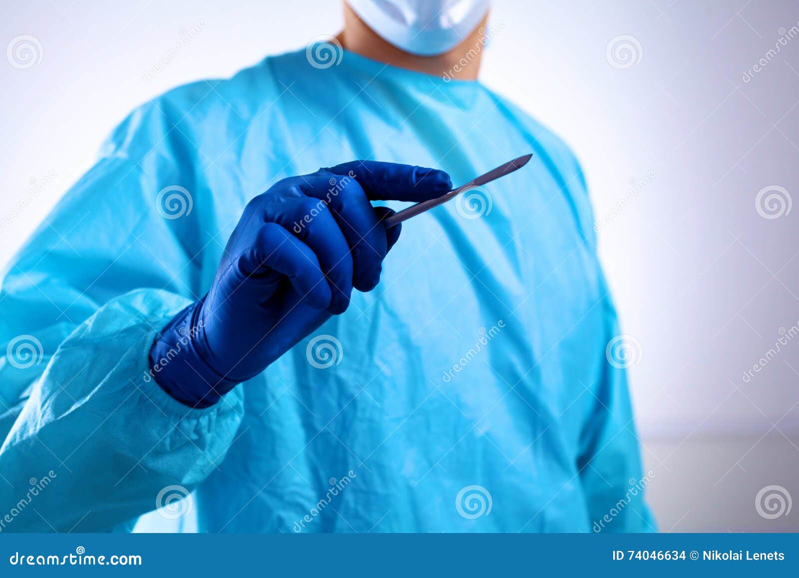 Young Surgeon Holding a Scalpel. Ready for Operation Stock Photo ...