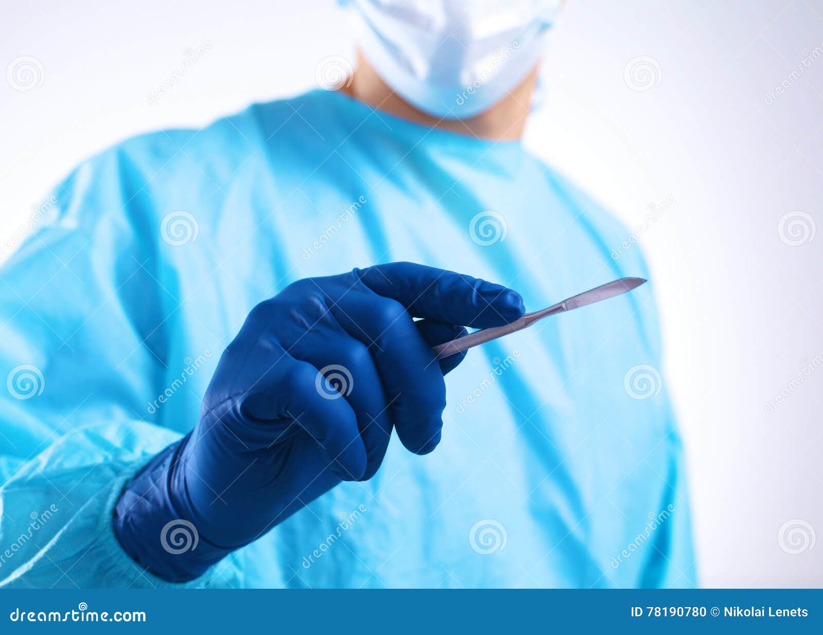 Young Surgeon Holding a Scalpel. Ready for Operation Stock Photo ...
