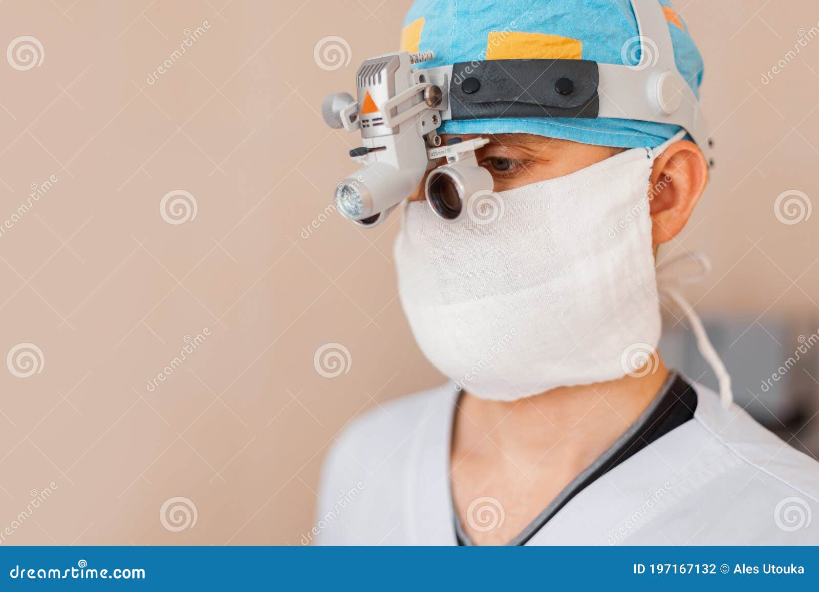 Young Surgeon Man in a White Coat with Professional Magnifying Glasses ...