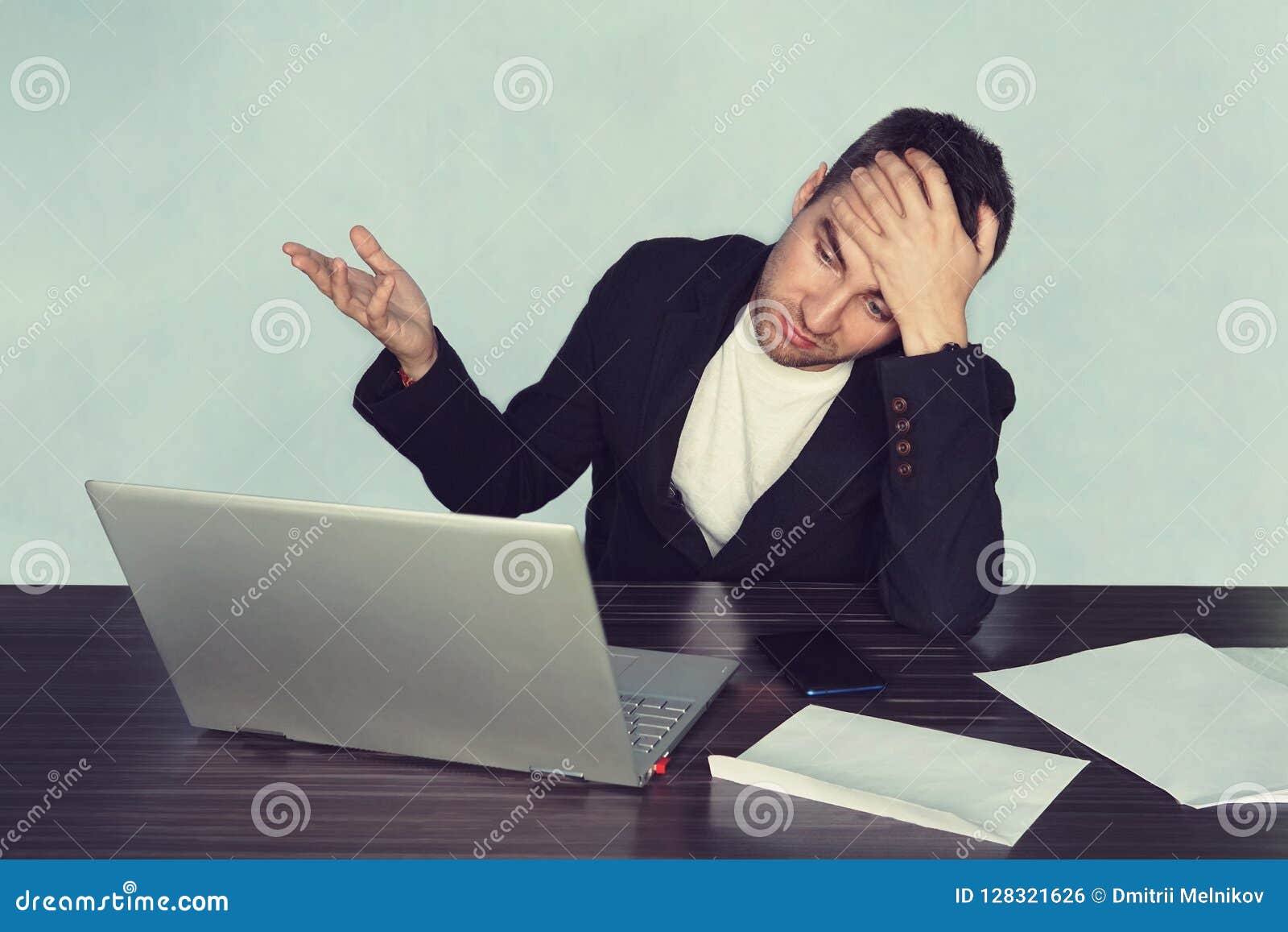 The Young Surprised Man with His Laptop Computer, Disappointment in ...