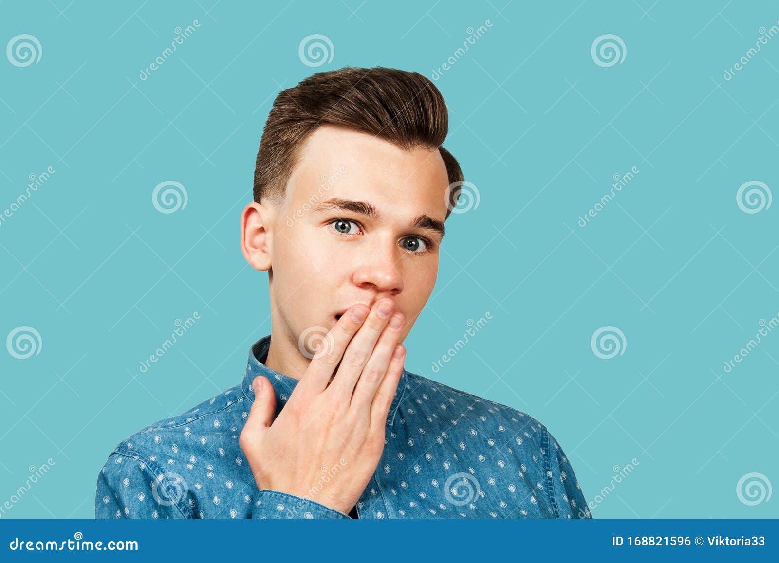 Young Surprised Man Student Closes His Mouth with His Hand Stock Photo ...