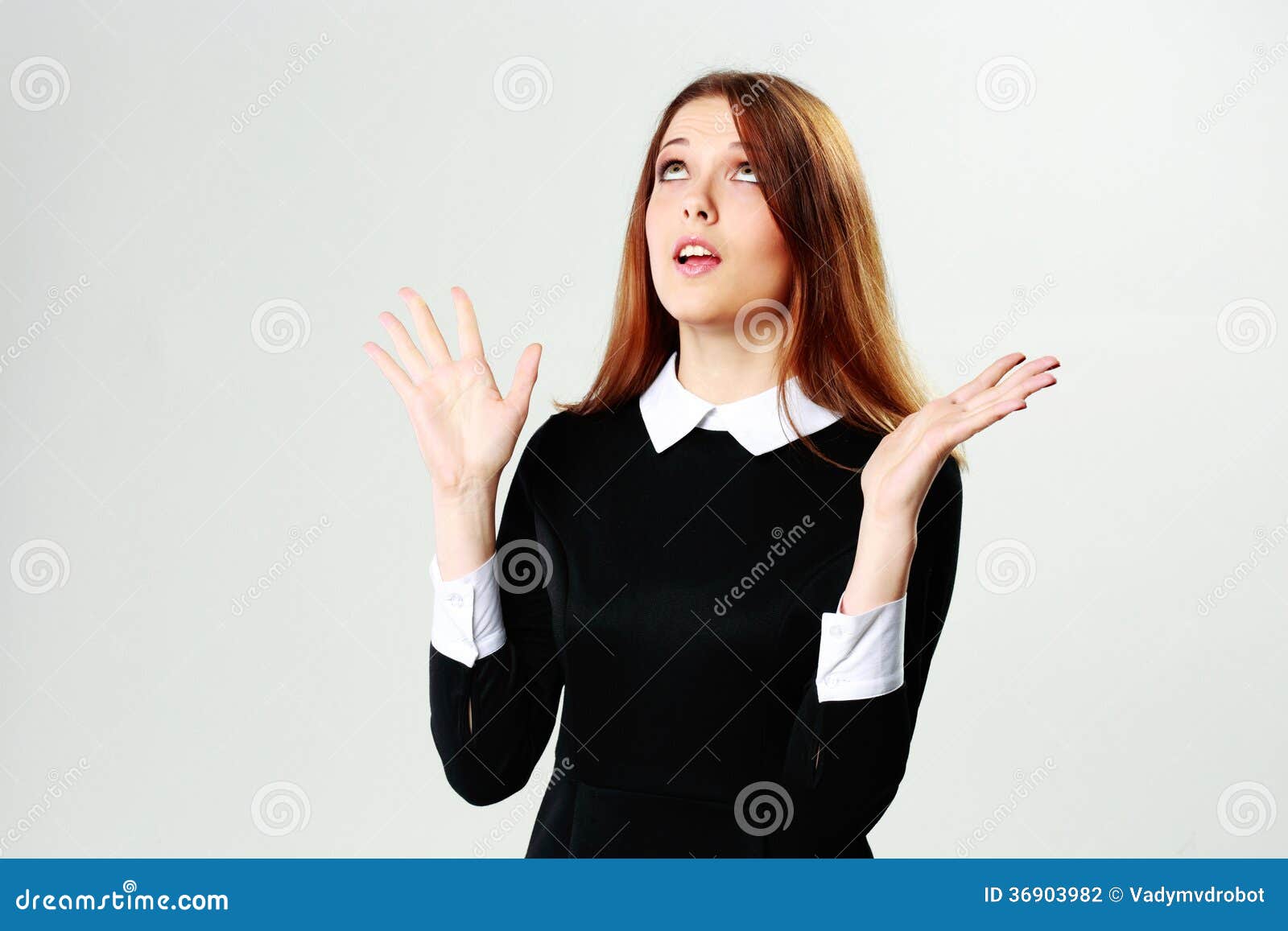 Young Surprised Woman Looking Up Stock Photo - Image of looking, hand ...