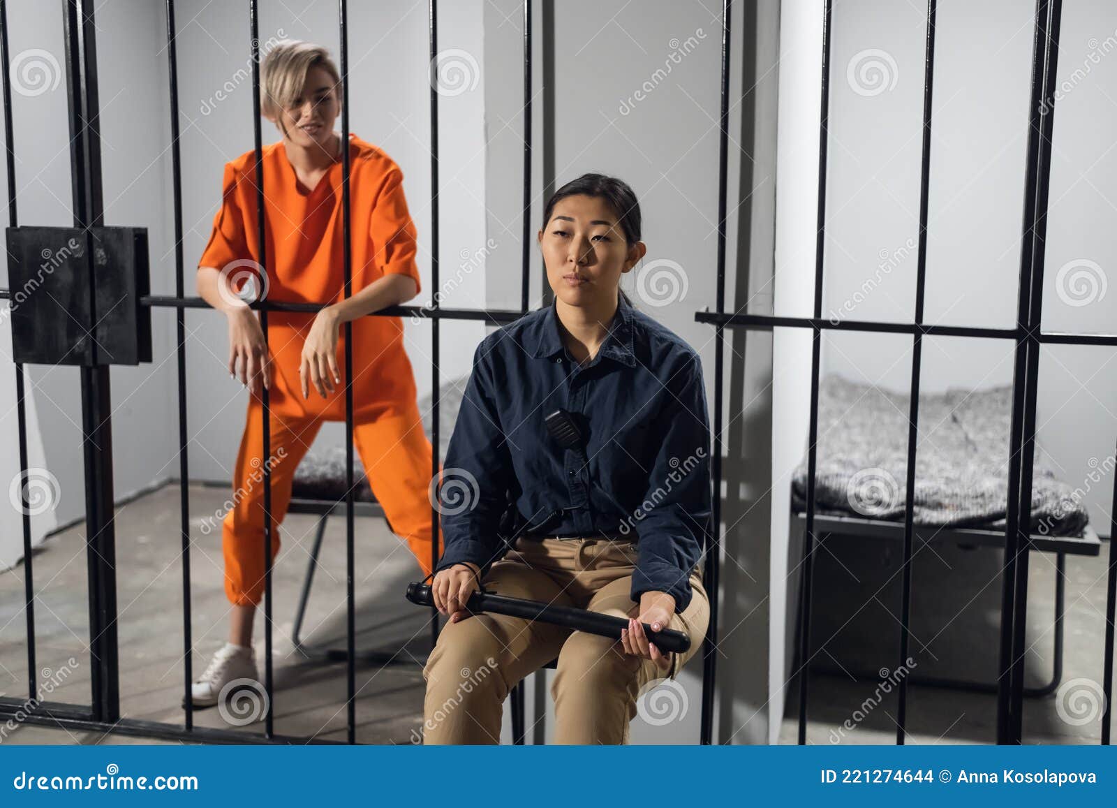 A Young Taskmaster in Uniform Sits on a Chair Next To the Camera of a ...
