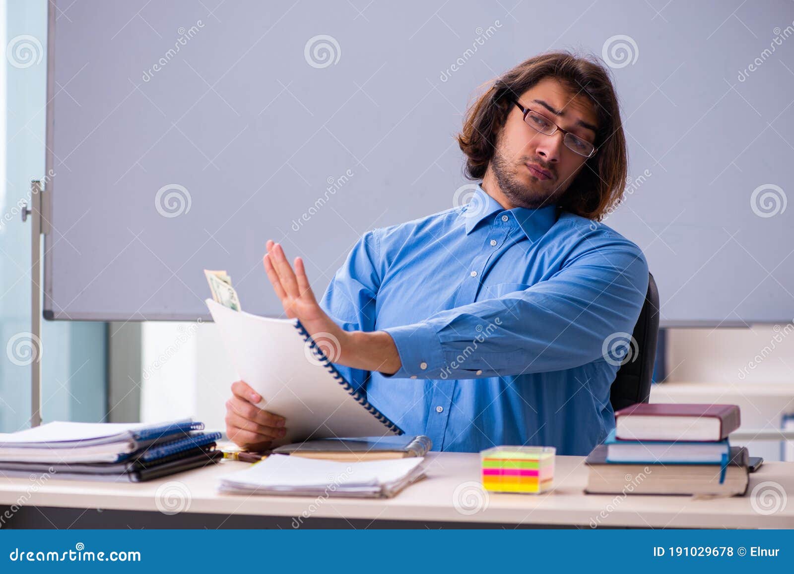 Young Male Teacher in the Classroom Stock Photo - Image of high ...