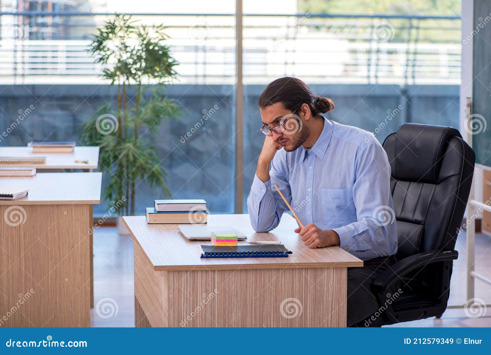 Young Male Teacher in the Classroom Stock Image - Image of studying ...
