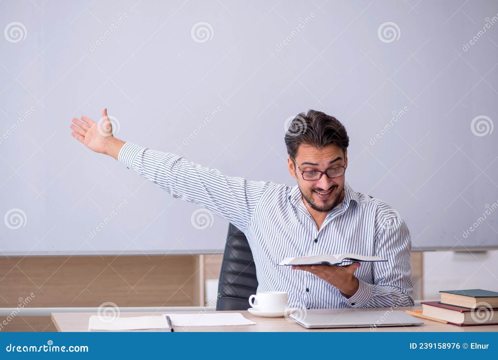 Young Male Teacher in the Classroom Stock Photo - Image of board ...
