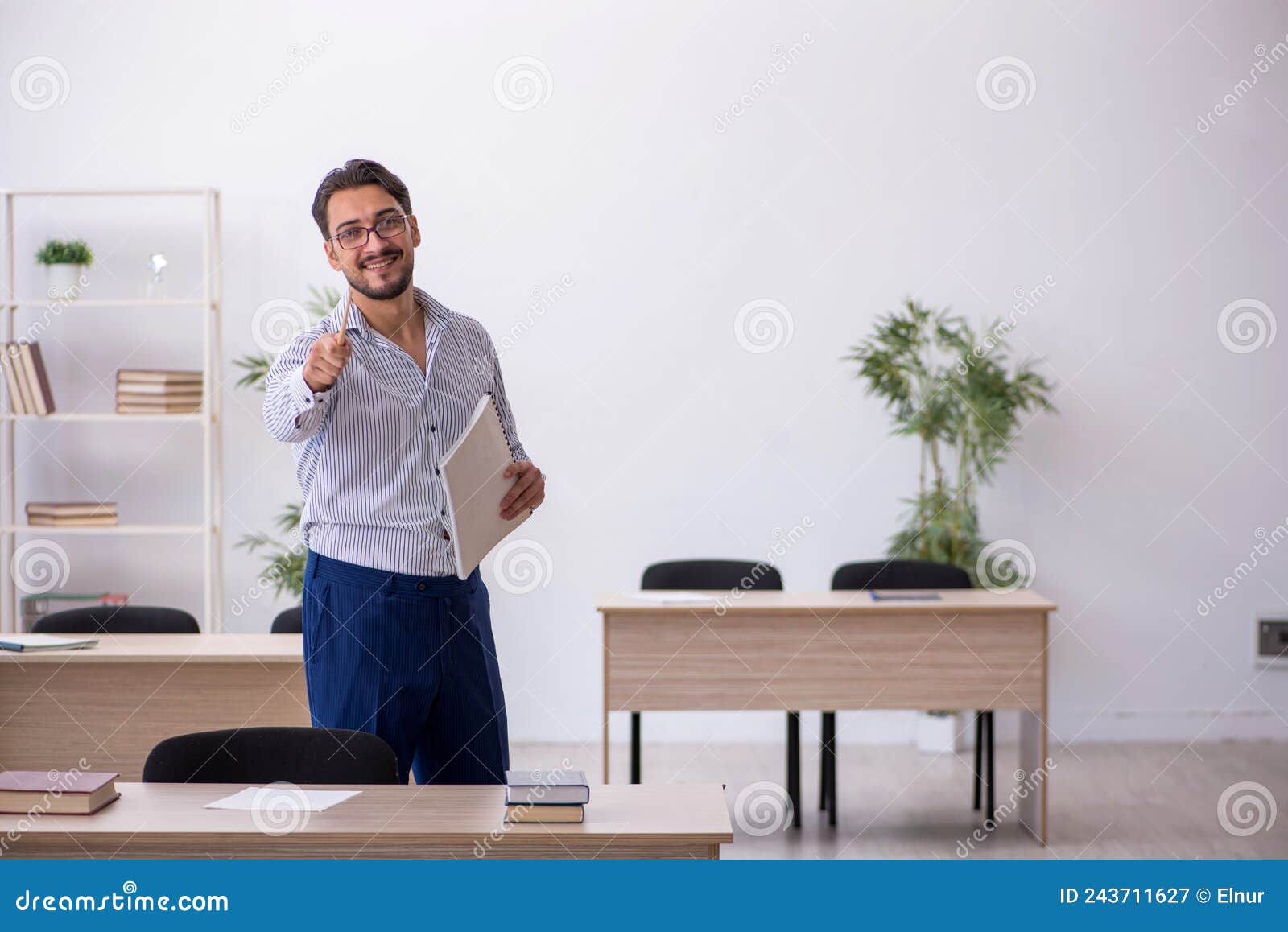 Young Male Teacher in the Classroom Stock Image - Image of tutor ...