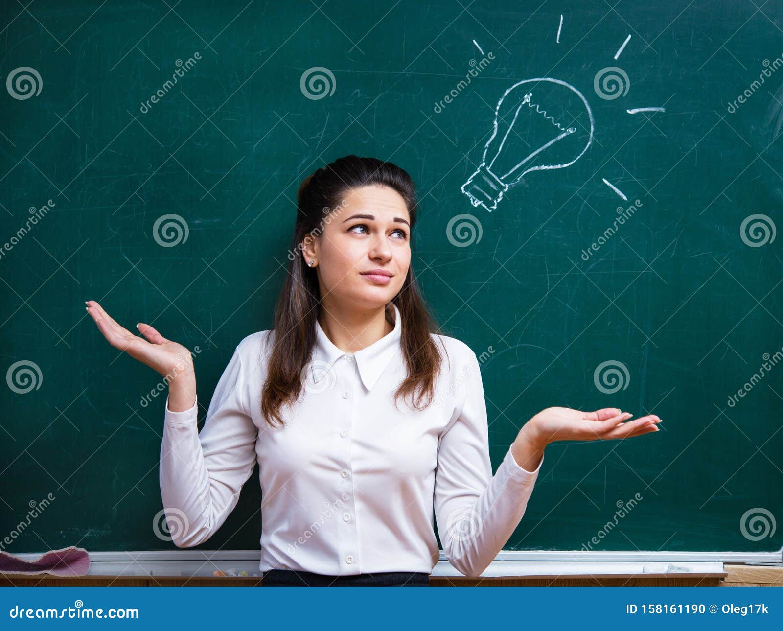 Young Teacher in Doubt Near Blackboard Stock Photo - Image of business ...
