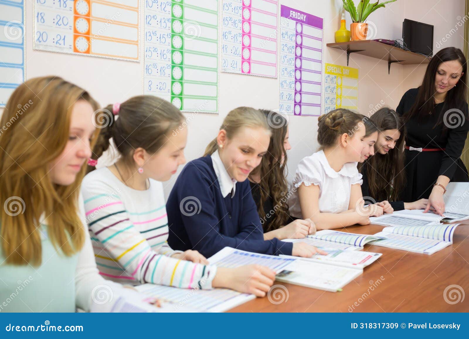 Young Teacher is Giving a Task To Her Seven Stock Image - Image of ...