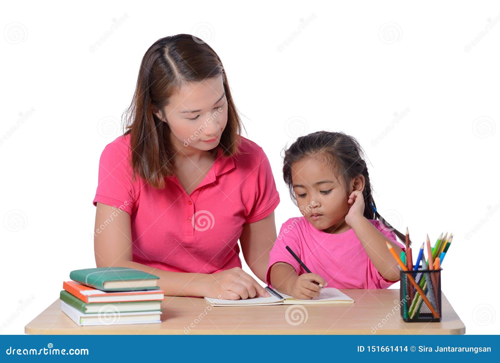 Young Teacher Helping Child With Writing Lesson Isolated On White ... Young Teacher Helping Child With Writing Lesson Isolated On White ...