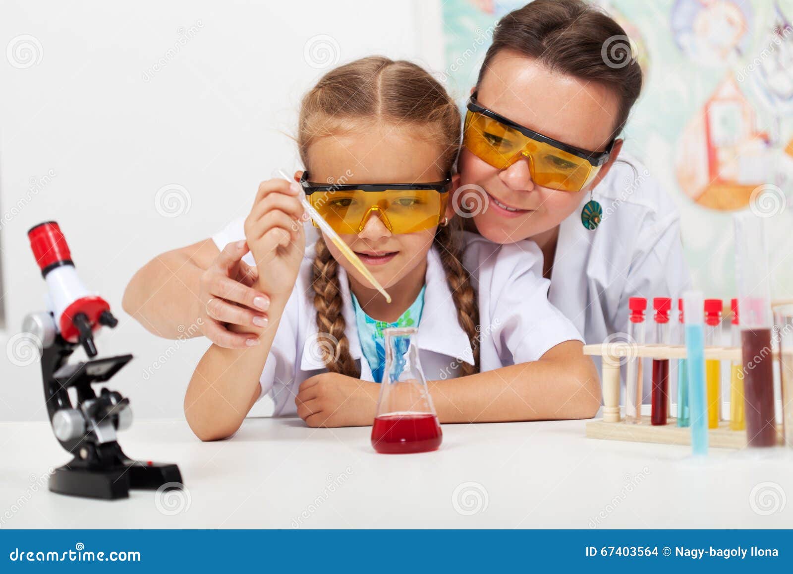 Young Teacher with Little Student at Elementary Science Class Stock ...