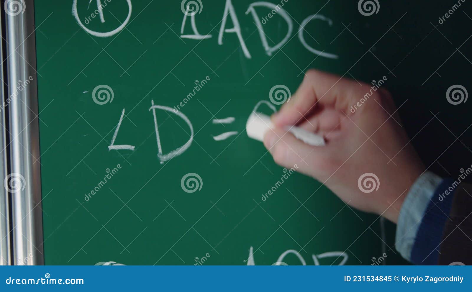 Young Teacher Man Writes Mathematical Formulas Using Chalk on a Green ...