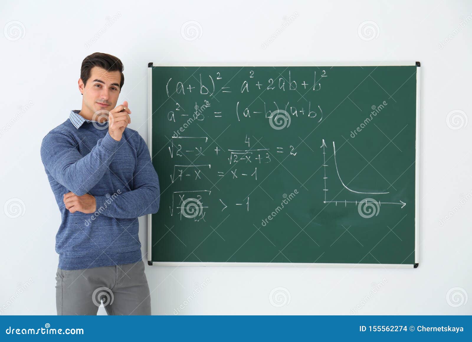 Young Teacher Near with Math Formulas in Classroom Stock Photo - Image ...
