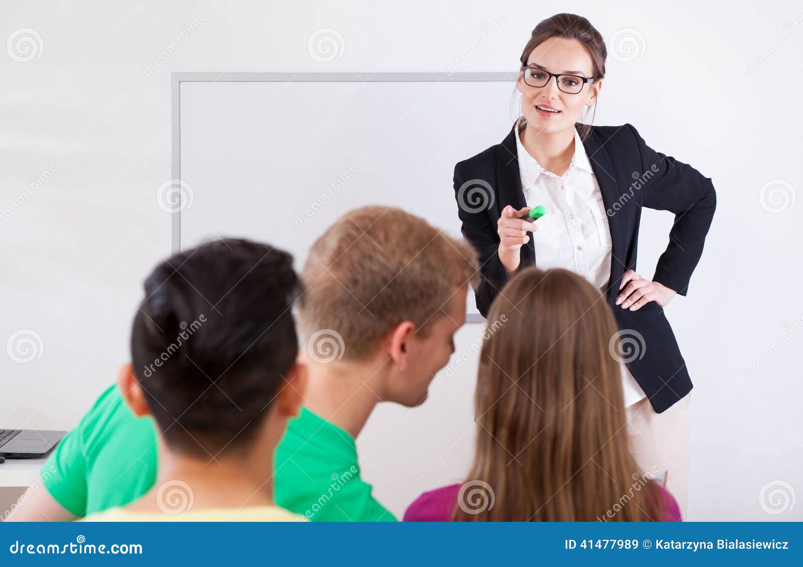 Young Teacher Pointing on Talking Student Stock Image - Image of ...