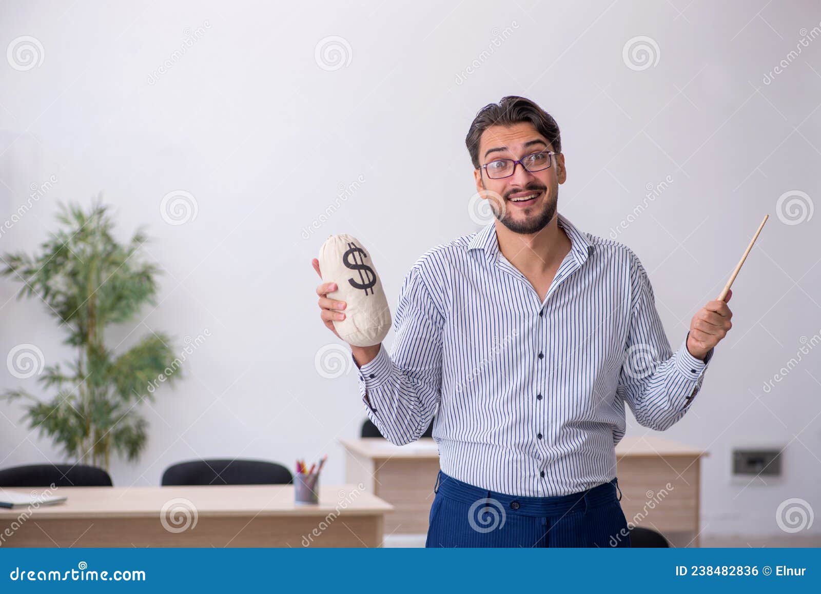 Young Male Teacher in Remuneration Concept Stock Photo - Image of ...
