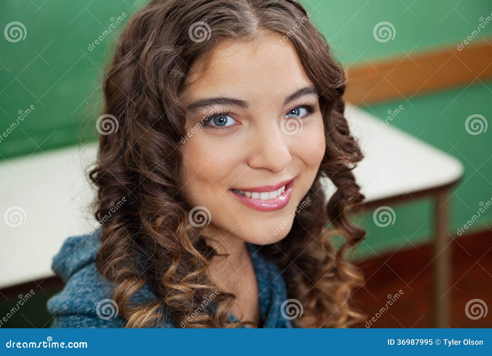 Young Teacher Smiling in Classroom Stock Image - Image of cute, girl ...