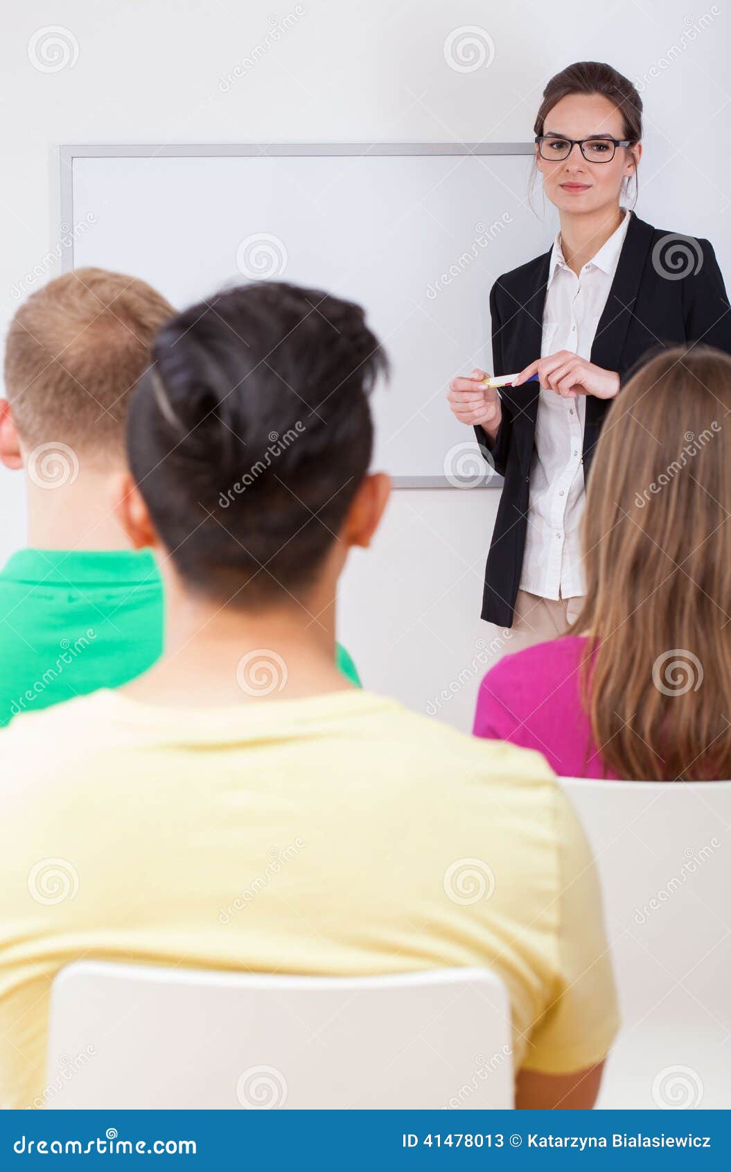 Young Teacher with Students Stock Image - Image of college, people ...