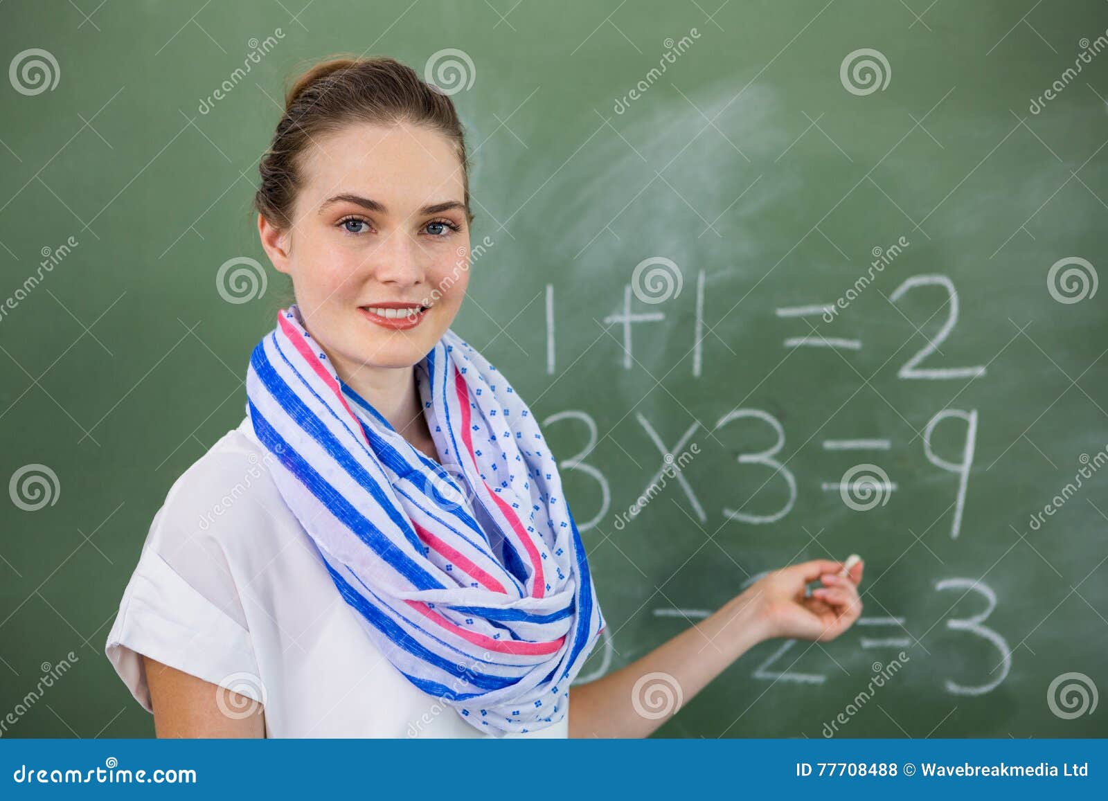 Young Teacher Teaching Mathematics on Chalkboard in Classroom Stock ...