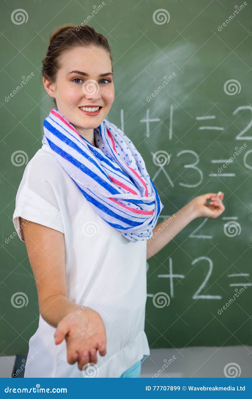 Young Teacher Teaching Mathematics in Classroom Stock Image - Image of ...