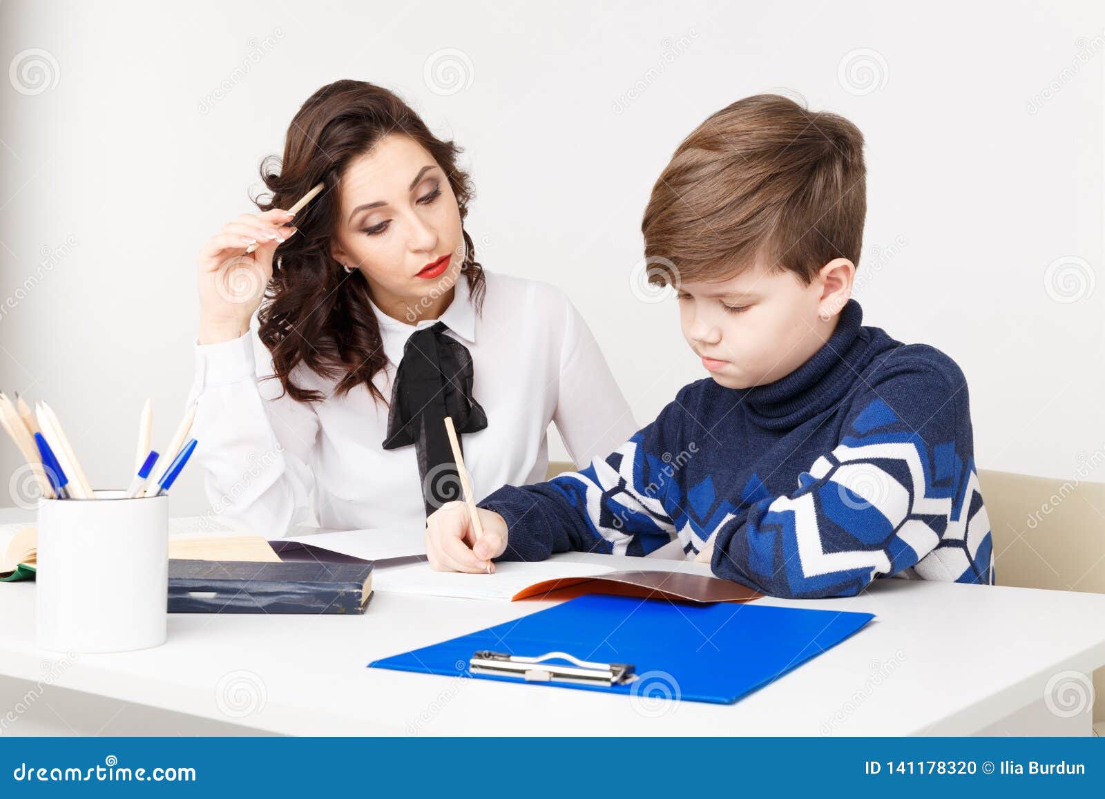 Young Teacher Trying To Explain Information To the Boy. Educating ...