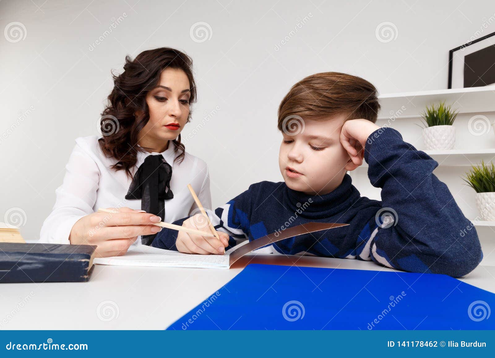 Young Teacher Trying To Explain Information To the Boy. Educating ...