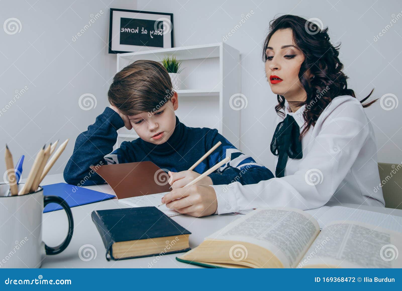 Young Teacher Trying To Explain Information To the Boy. Educating ...