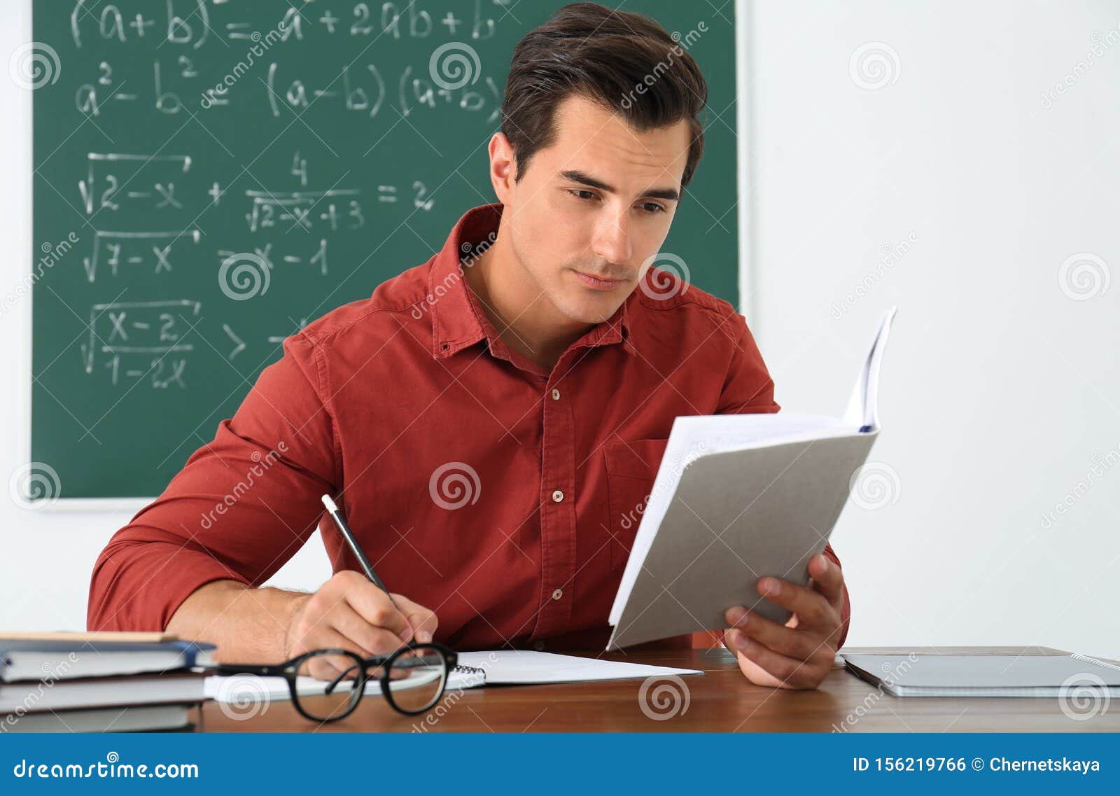 Young Teacher Working at Table Stock Photo - Image of lecturer, school ...