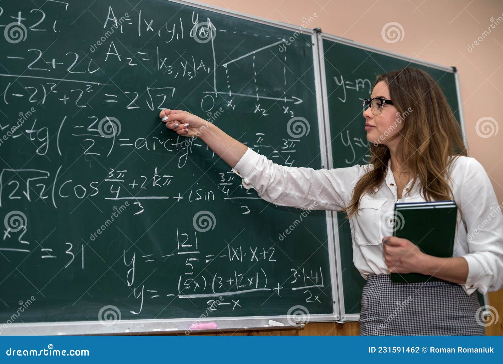 Young Teacher Writing and Explain the Mathematical Formulas on a ...