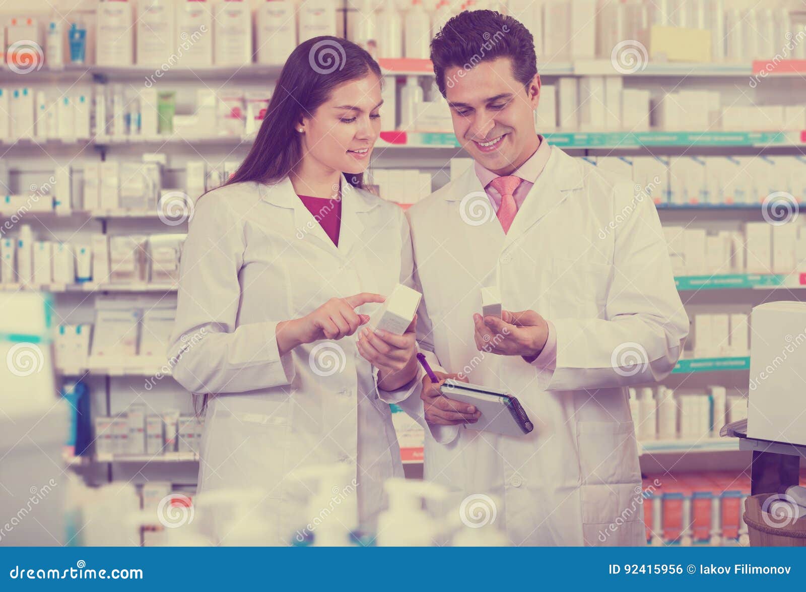 Young team in chemist shop stock photo. Image of pharmaceutist - 92415956