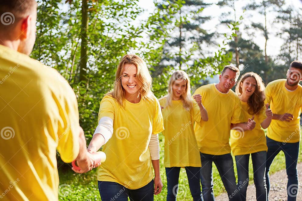 Young Team is Doing an Exercise with Baton Stock Photo - Image of ...