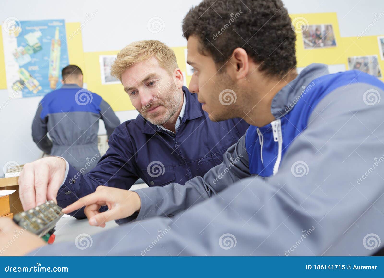 Young Technician Asking Question in Electronics Class Stock Image ...