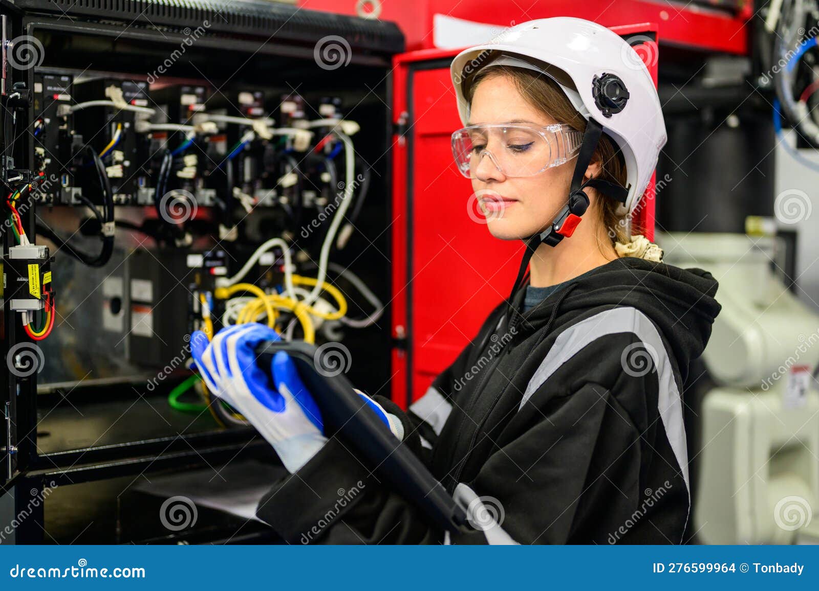 Young Technician Checking and Repairing Part of Automatic Machine Stock ...