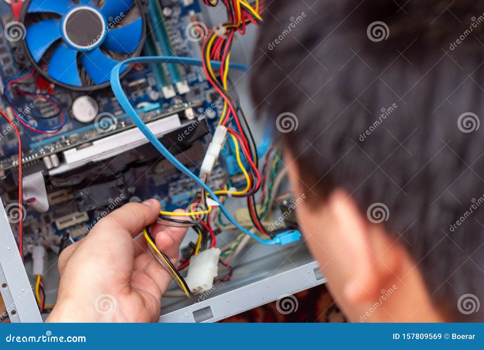 The Young Technician Hold the Screwdriver for Repairing the Computer in ...
