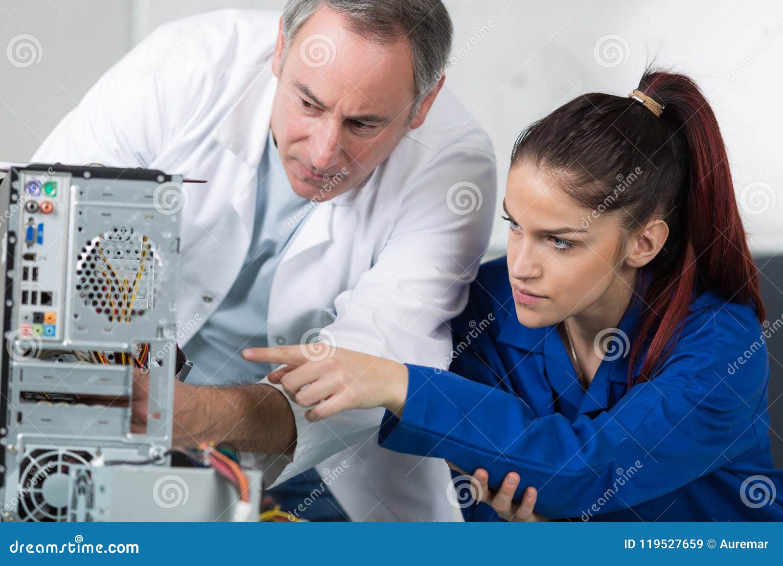 Young Technician Making Observation To Supervisor Stock Image - Image ...