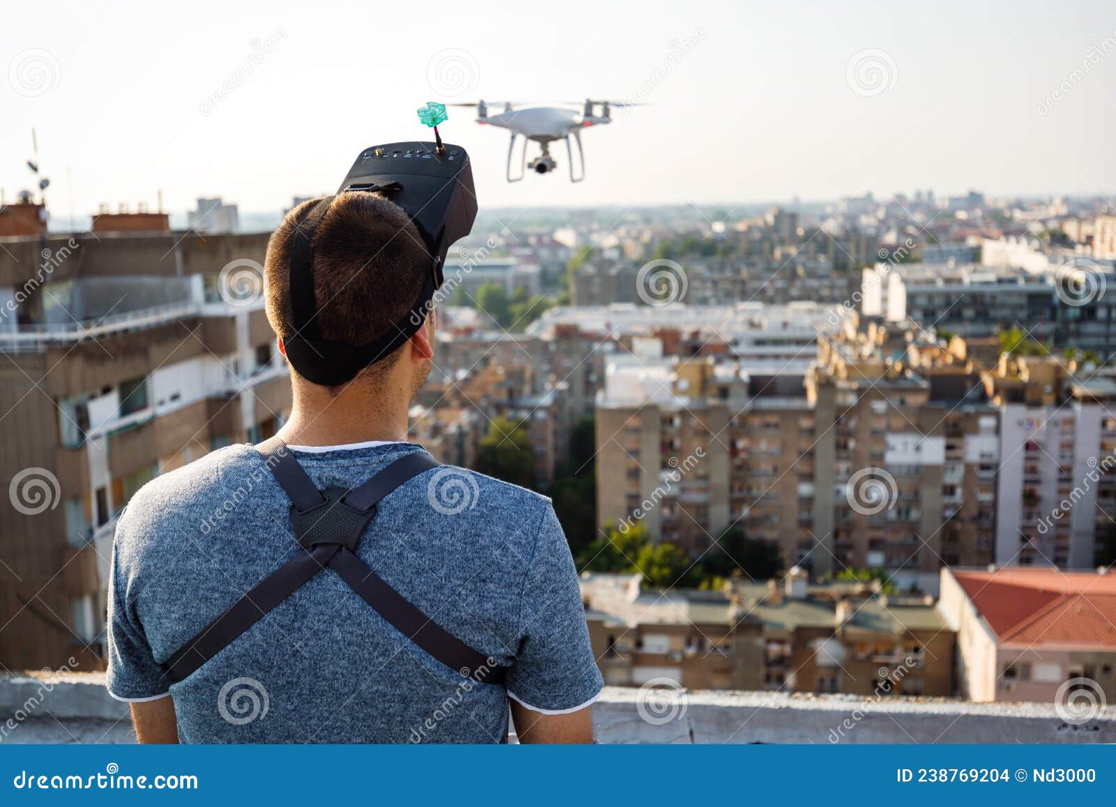 Young Technician Man Flying UAV Drone with Remote Control in City Stock ...