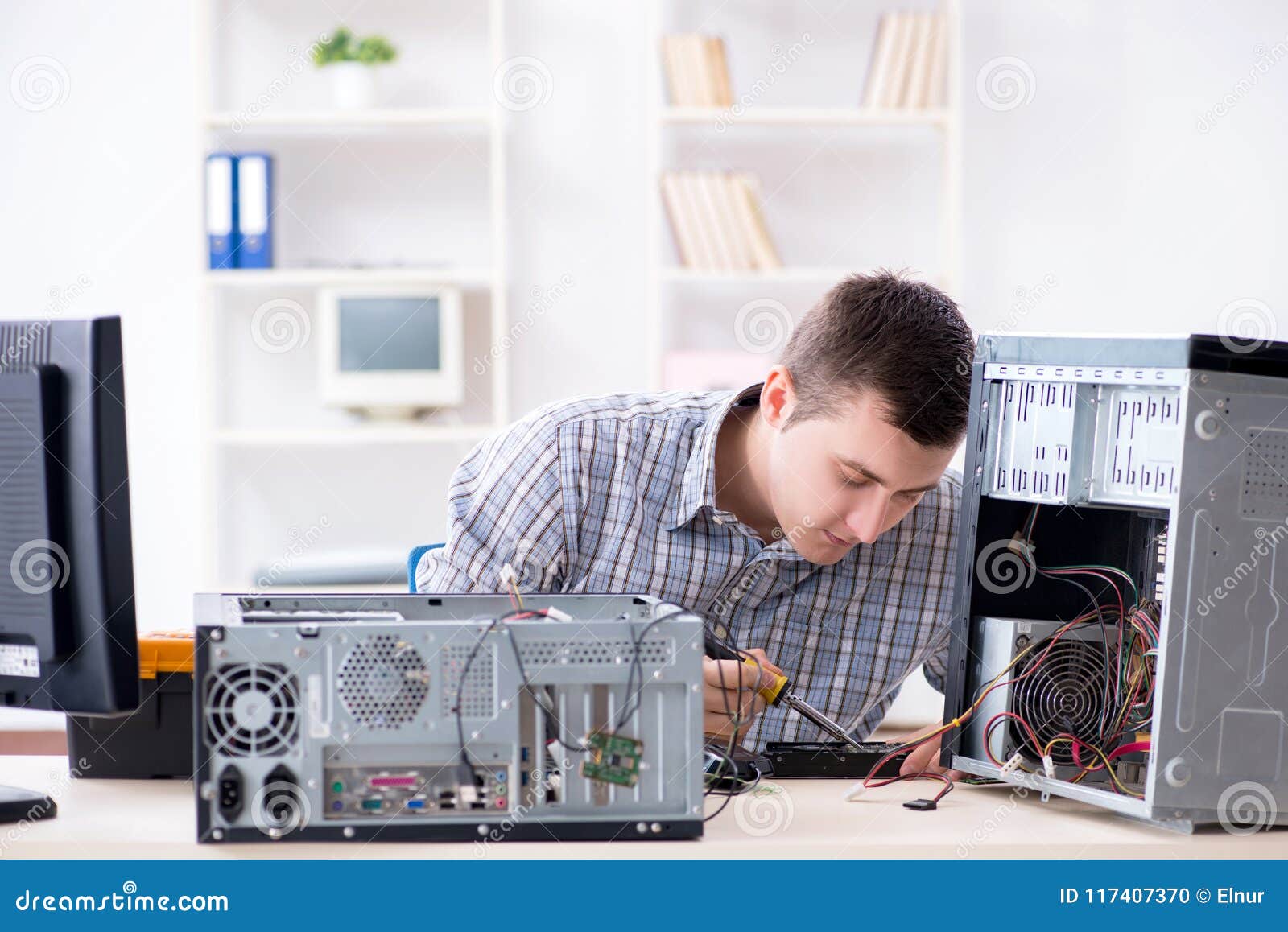 The Young Technician Repairing Computer in Workshop Stock Photo - Image ...