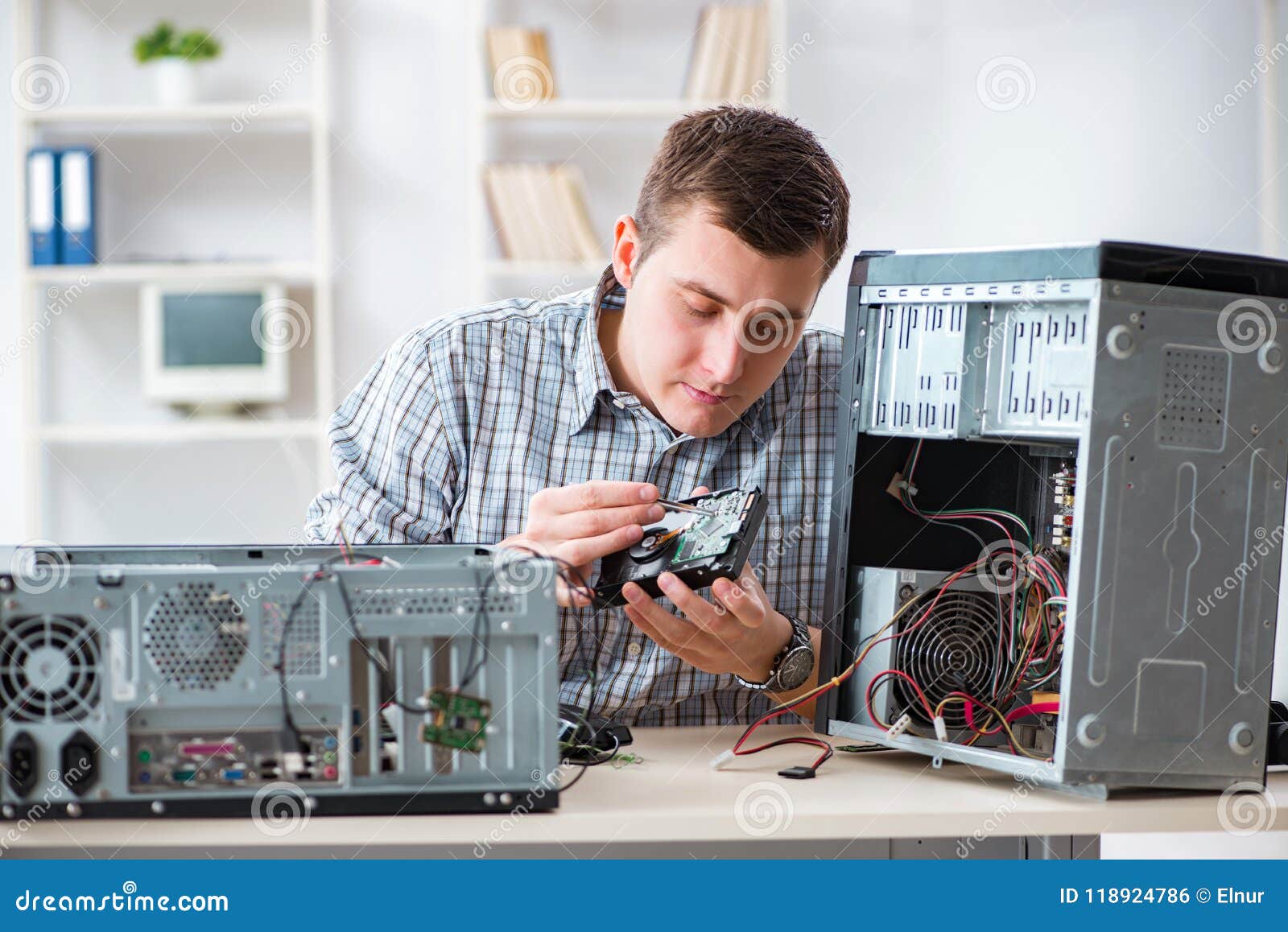 The Young Technician Repairing Computer in Workshop Stock Photo - Image ...