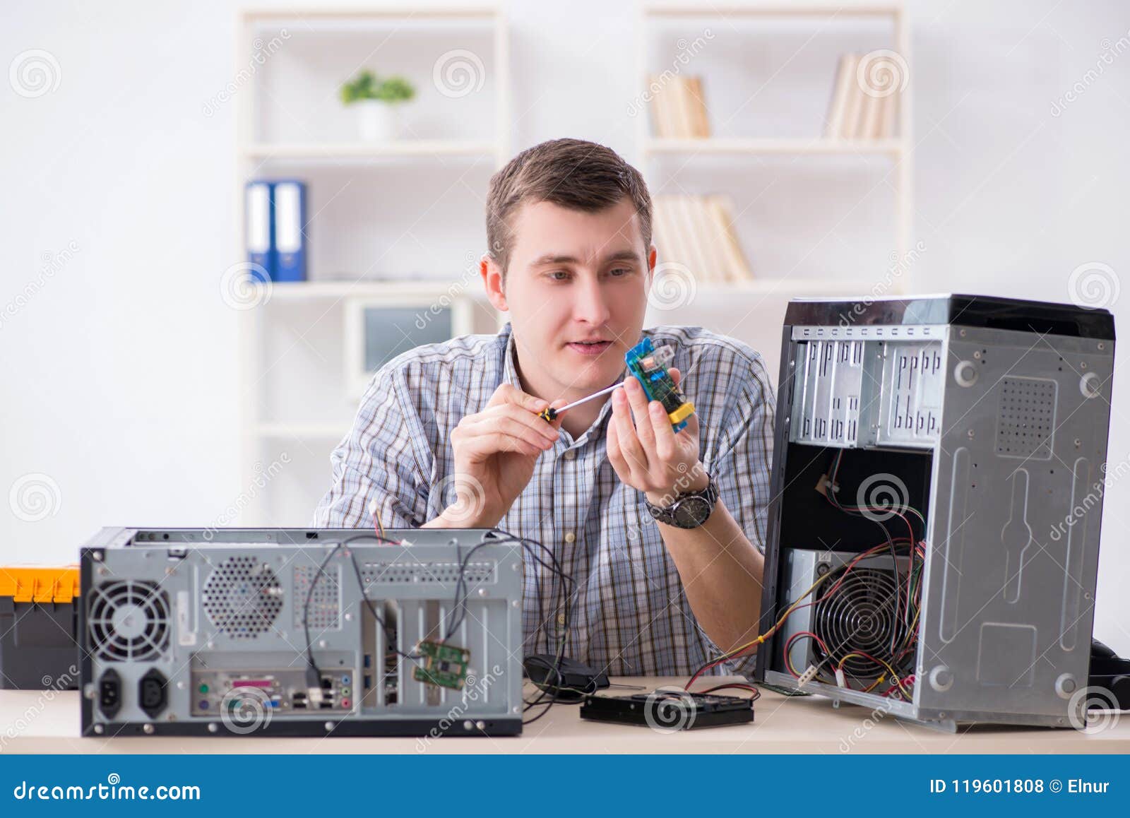 The Young Technician Repairing Computer in Workshop Stock Photo - Image ...