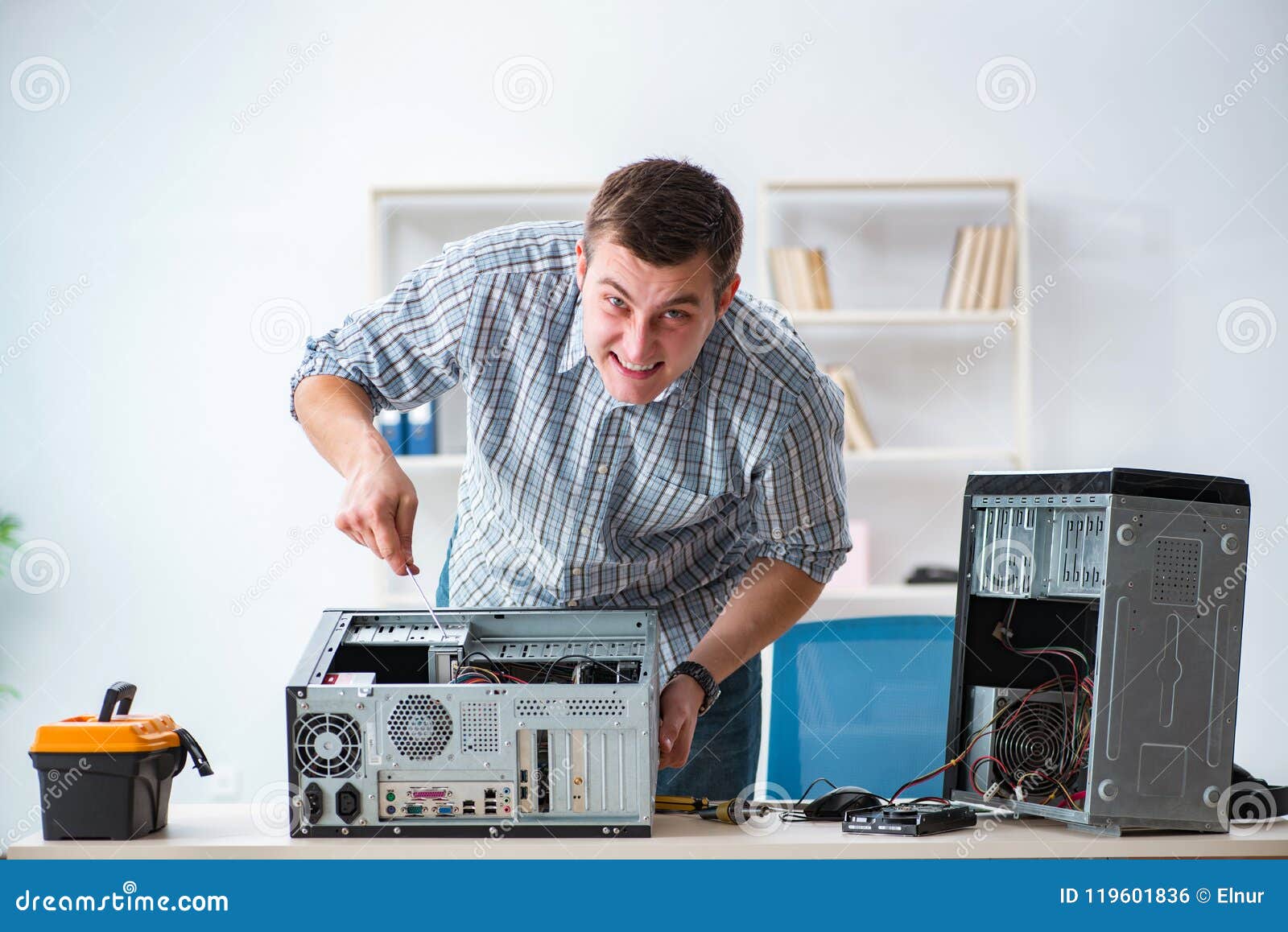 The Young Technician Repairing Computer in Workshop Stock Photo - Image ...