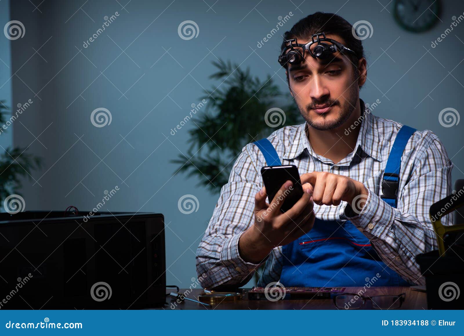 Young Male Technician Repairing Computer in Workshop at Night Stock ...