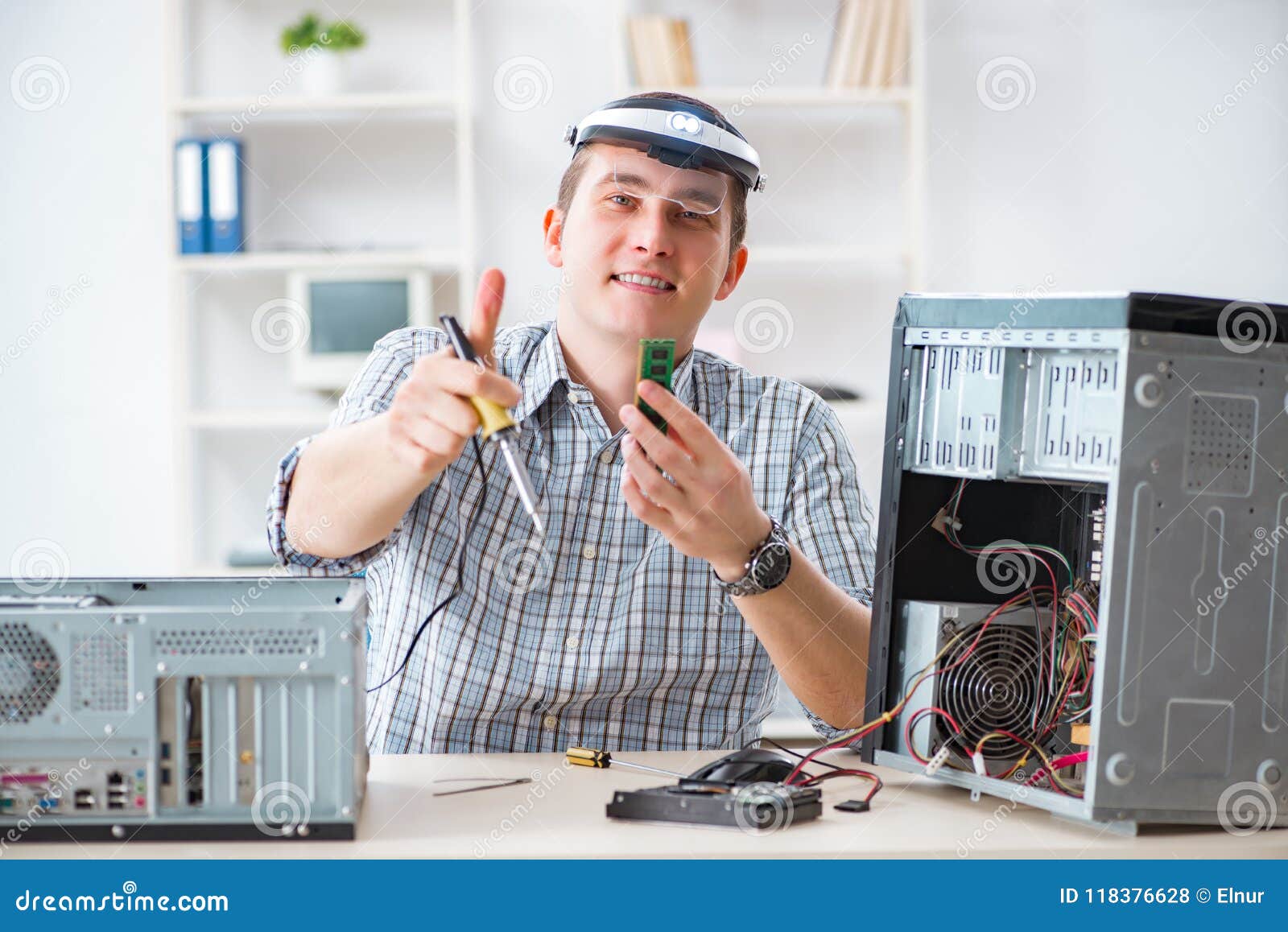 The Young Technician Repairing Computer in Workshop Stock Photo - Image ...