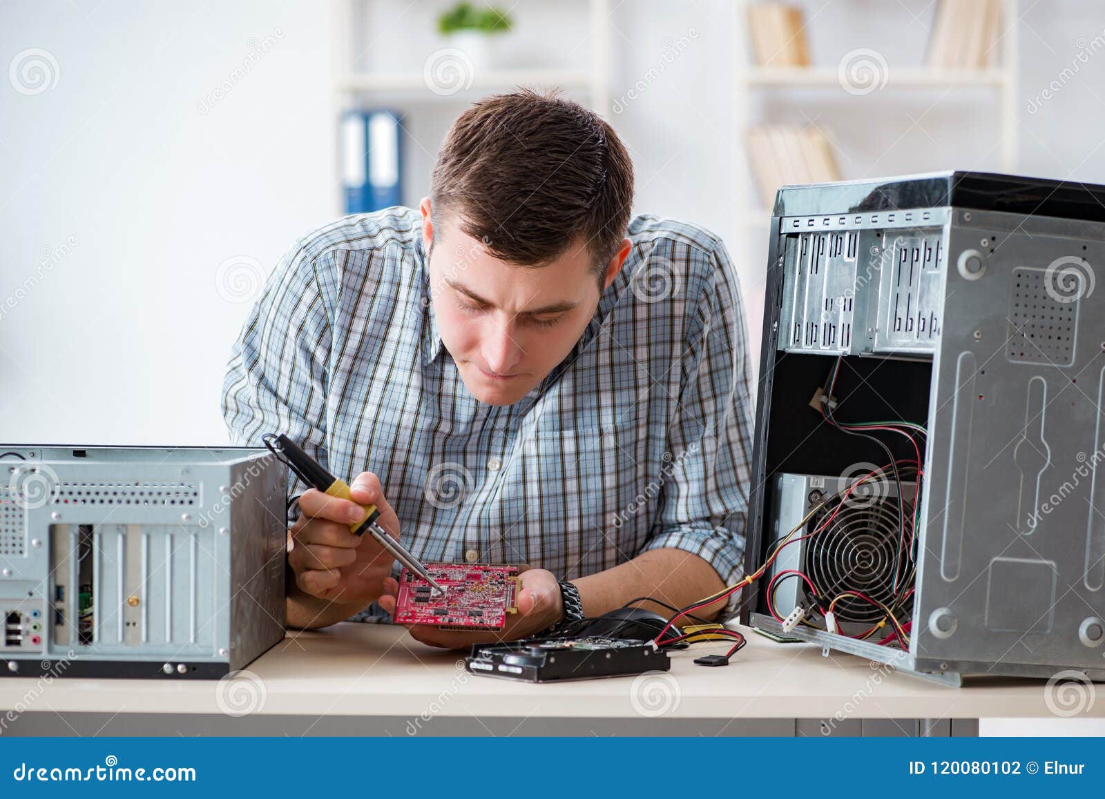 The Young Technician Repairing Computer in Workshop Stock Photo - Image ...
