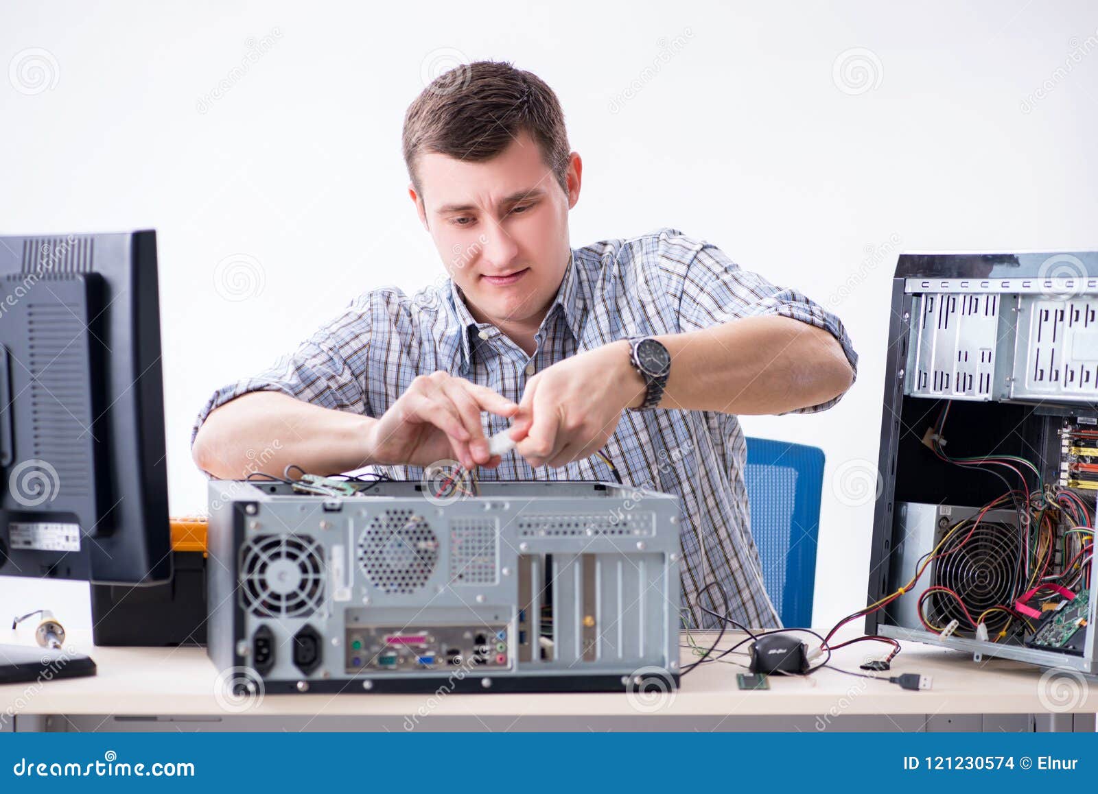 The Young Technician Repairing Computer in Workshop Stock Photo - Image ...