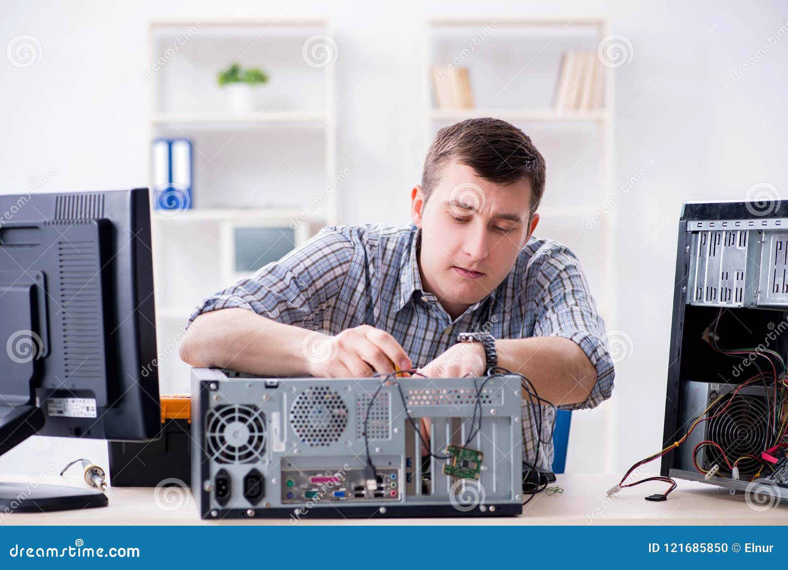 The Young Technician Repairing Computer in Workshop Stock Photo - Image ...