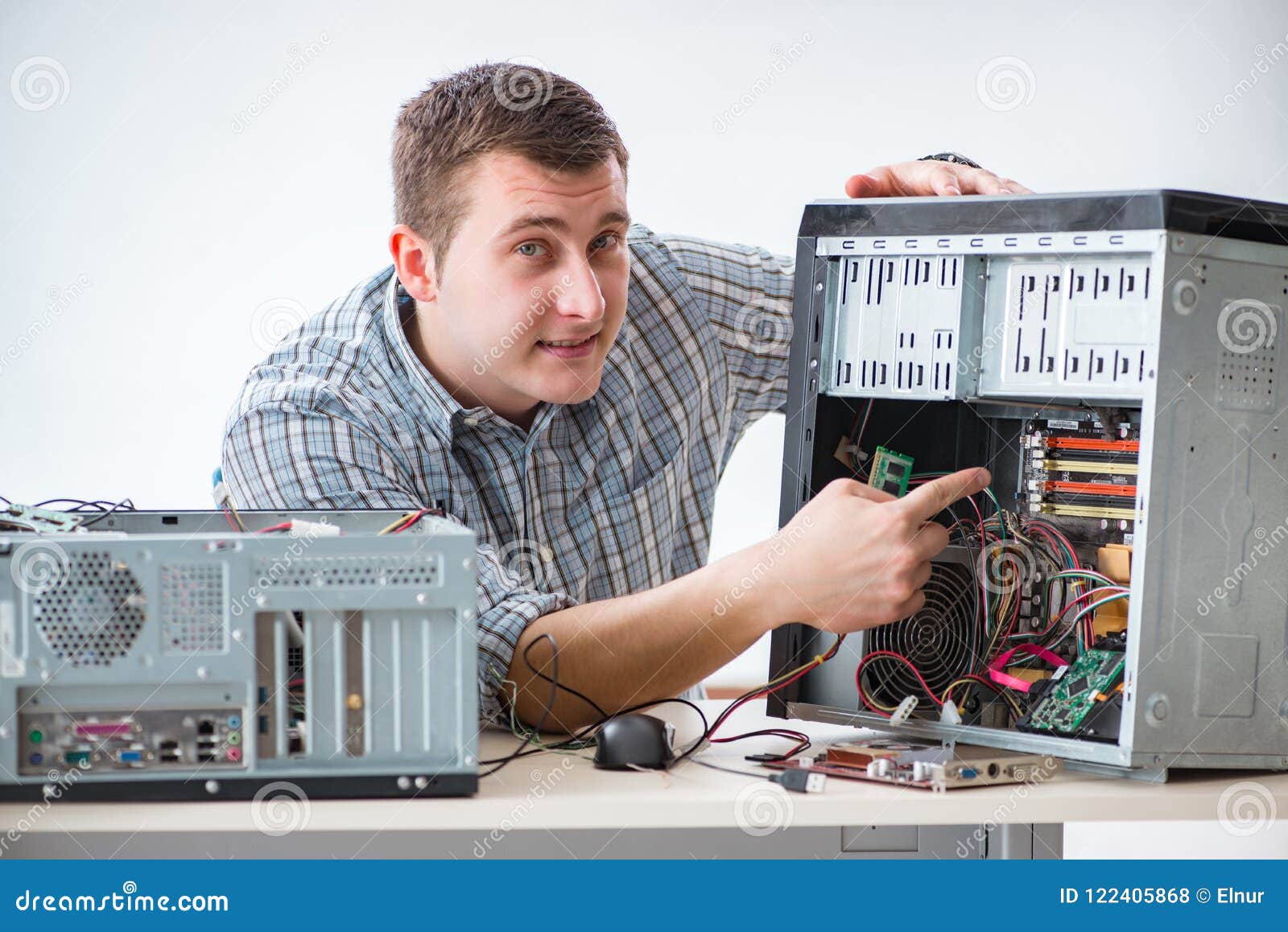 The Young Technician Repairing Computer in Workshop Stock Photo - Image ...