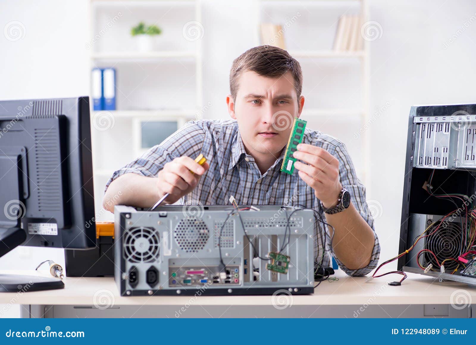 The Young Technician Repairing Computer in Workshop Stock Image - Image ...